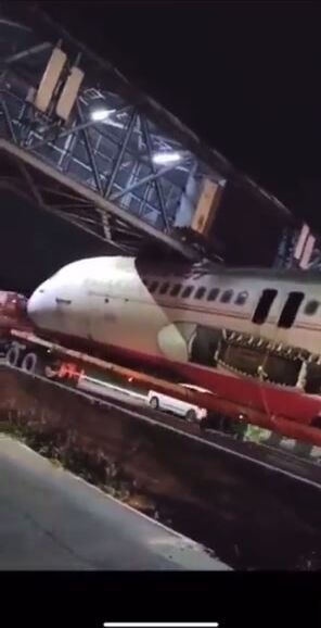 Truck Transporting Fuselage Crashes Into Pedestrian Bridge
